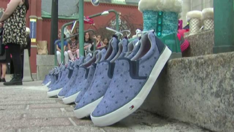 Dozens of pairs of shoes symbolize abused children | WRGB