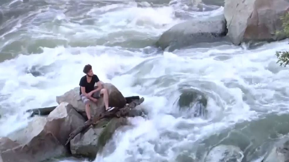 California authorities rescue man stuck on rock in middle of raging ...