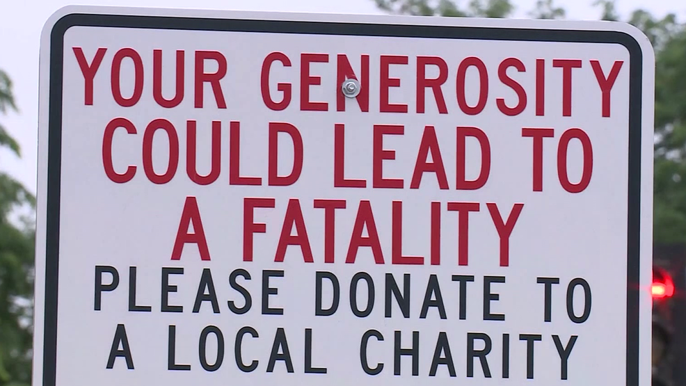 Signs ask drivers give to charity, not panhandlers | WOAI